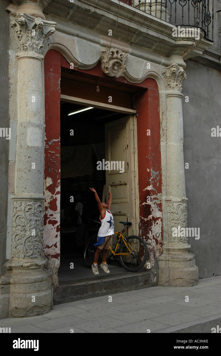 Child jumping Oaxaca city Mexico Stock Photo - Alamy