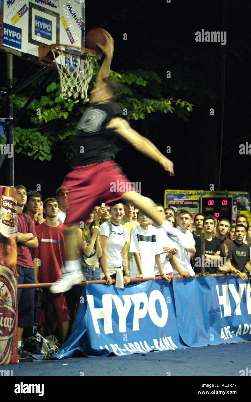 Basketball Player Shooting a Ball into a Hoop Stock Photo - Alamy