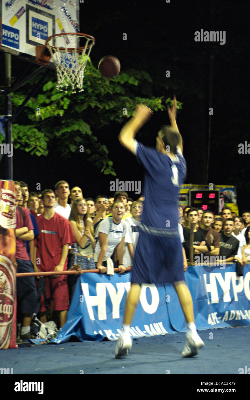 Basketball Player Shooting a Ball into a Hoop Stock Photo - Alamy