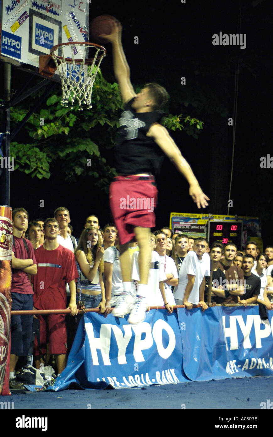 Basketball Player Shooting a Ball into a Hoop Stock Photo - Alamy
