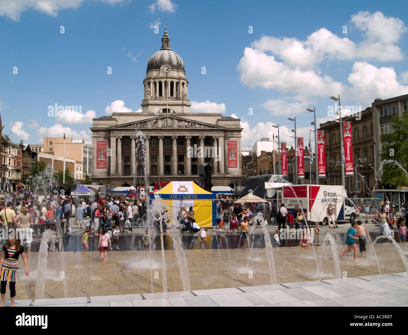 People playing in the fountains during an RAF exhibition in the Market ...