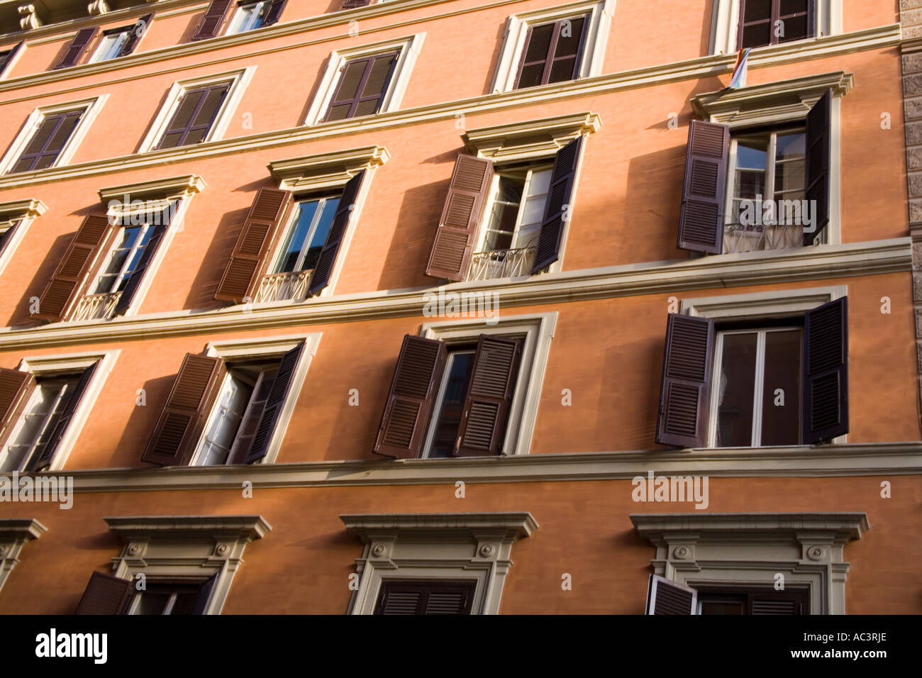 Apartment block and shuttered windows in Rome Italy Stock Photo - Alamy