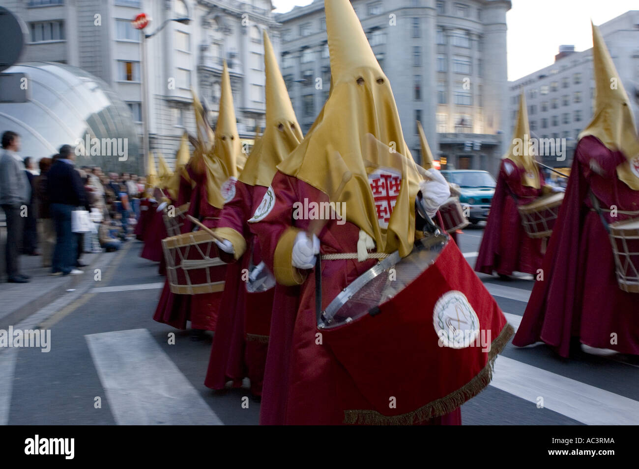 Penitents beating drums, Easter religious procession, Semana Santa ...