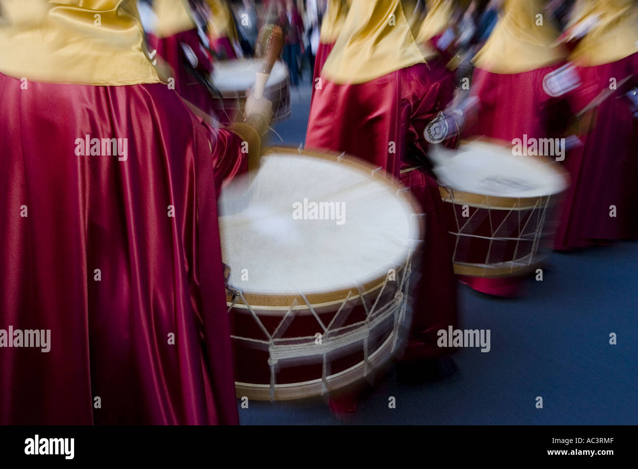 Penitents beating drums, Easter religious procession, Semana Santa ...