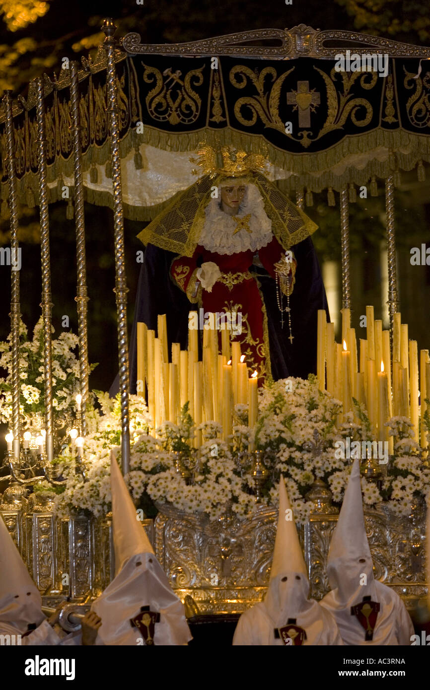 Religious float illuminated by candles during Holy Week procession ...