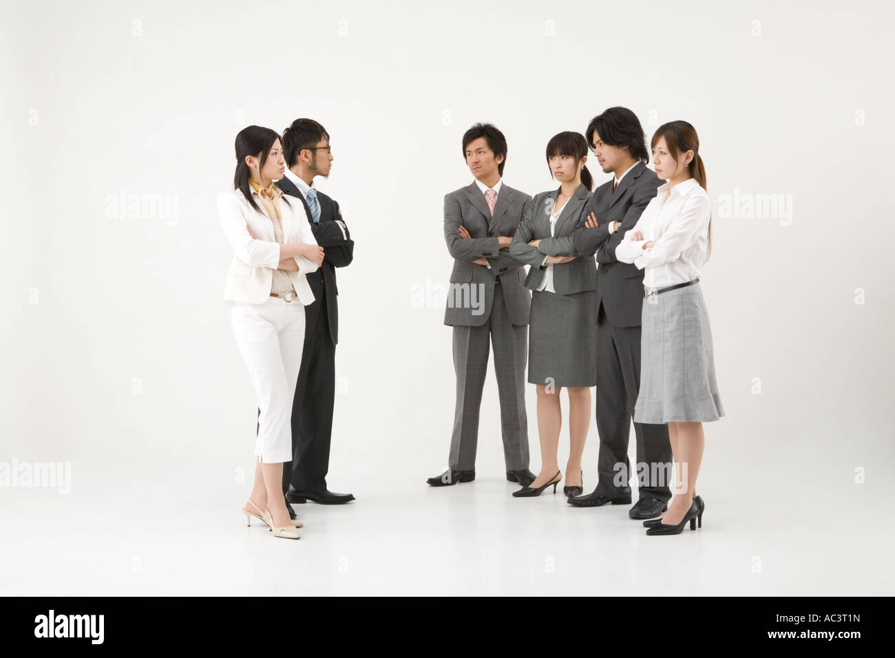 Business people glaring at each other Stock Photo - Alamy