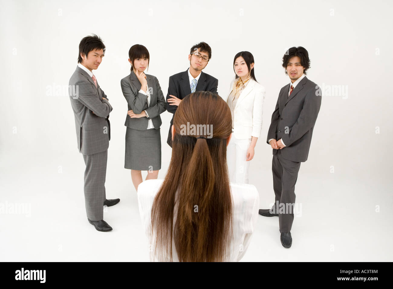 Businesswoman excluded from group of business people Stock Photo - Alamy
