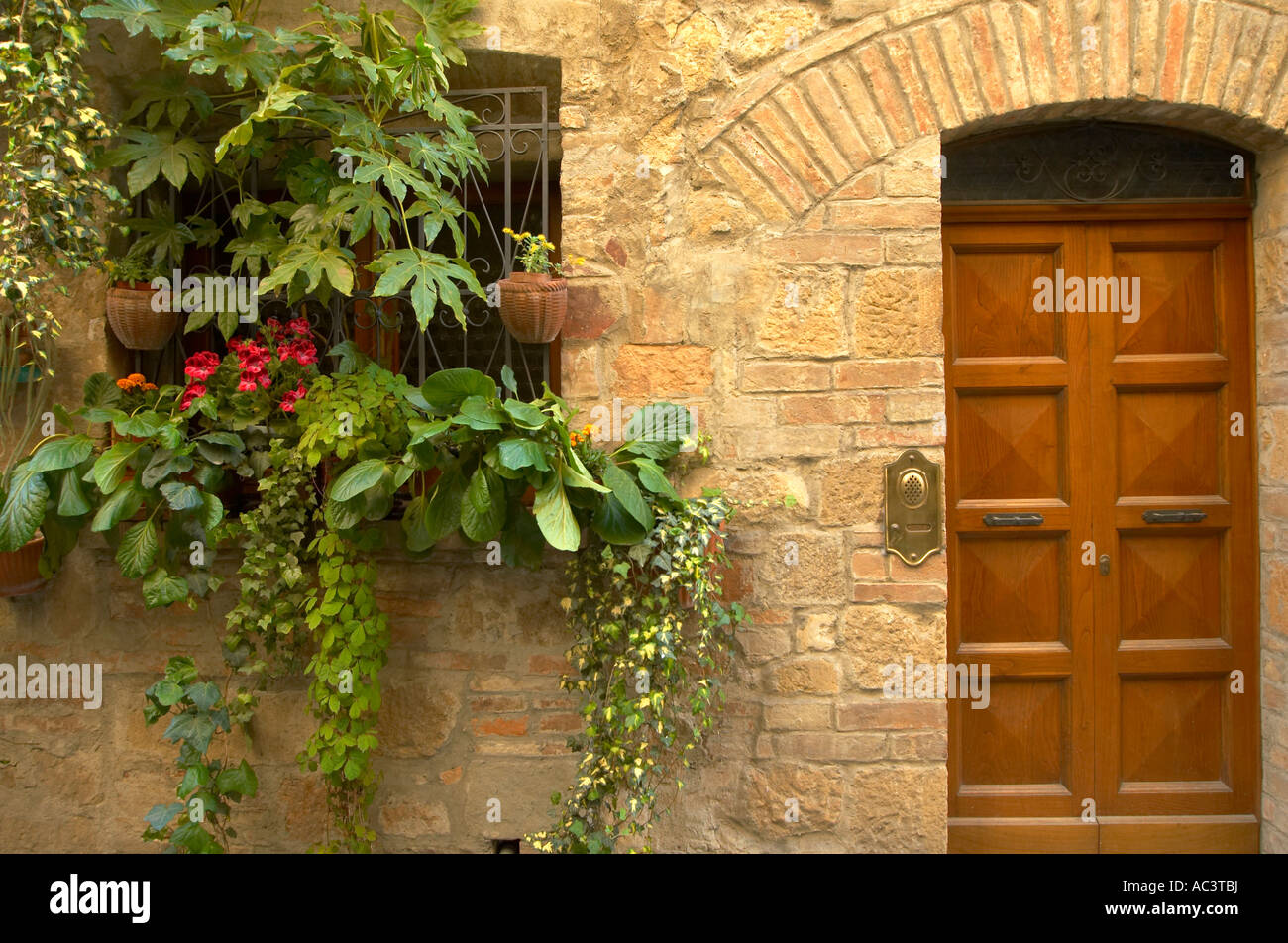 Walls and flowers in villages in Tuscany region of Italy Stock Photo ...