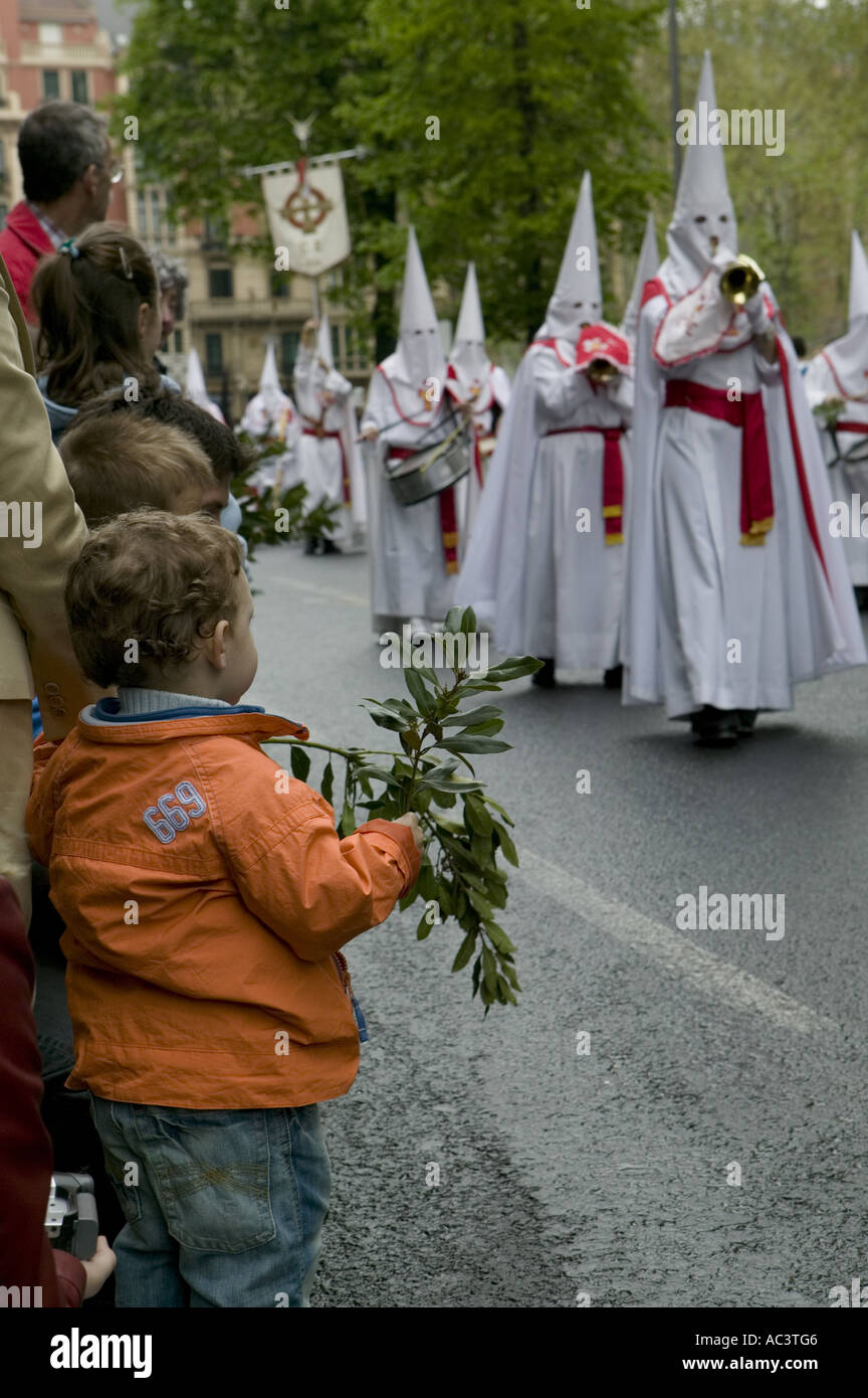 Small boy watching Semana Santa (Holy Week) religious procession Bilbao ...