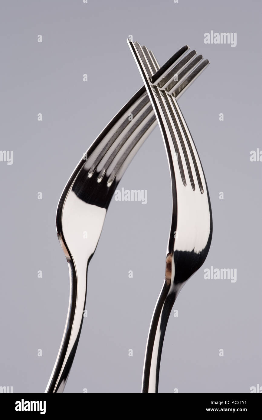 two forks joined Stock Photo - Alamy