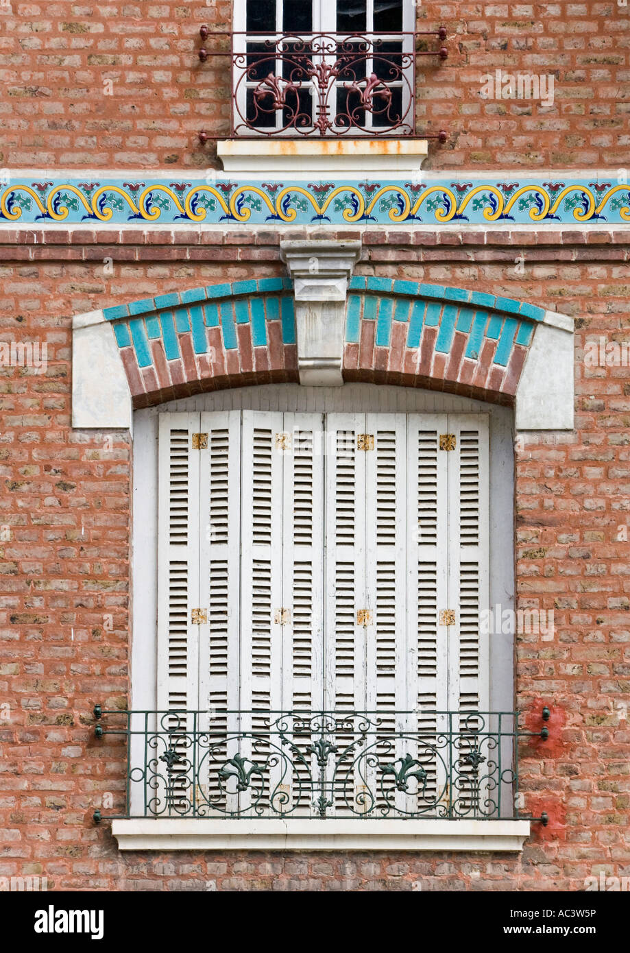 Closed white wooden window shutters and juliet balcony, ornamental ...