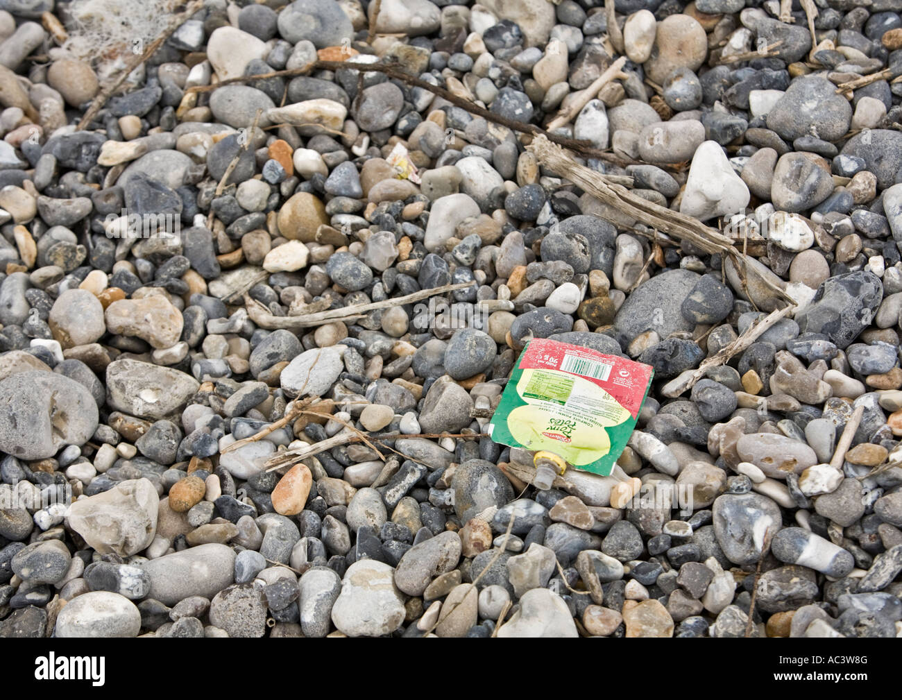 Plastic food packaging thrown away on shingle beach in france eu Stock ...