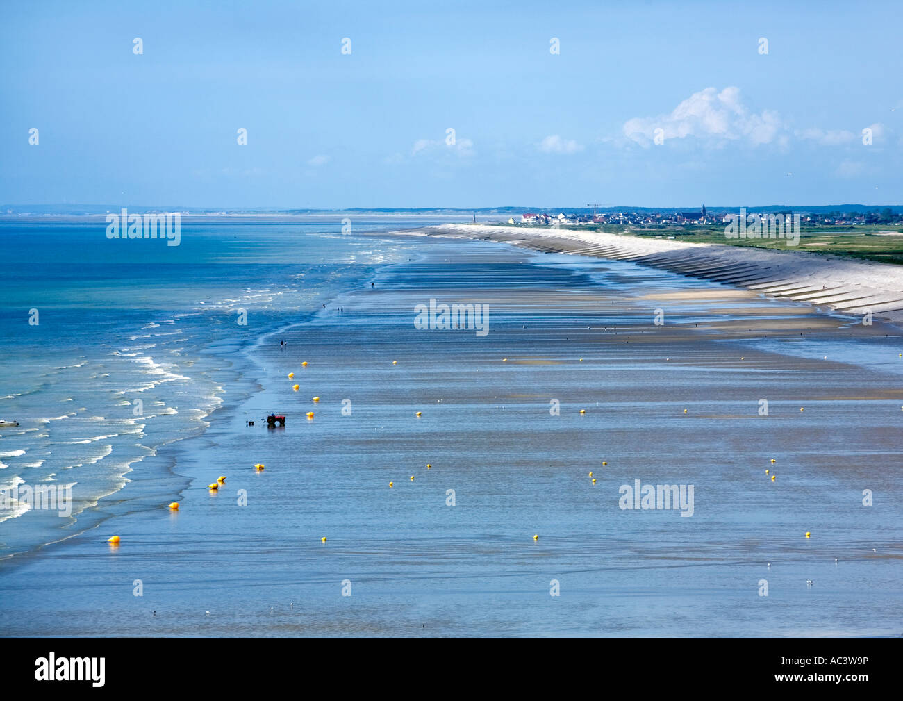 aerial view of beach with receding tide and blue sky in ault picardie ...