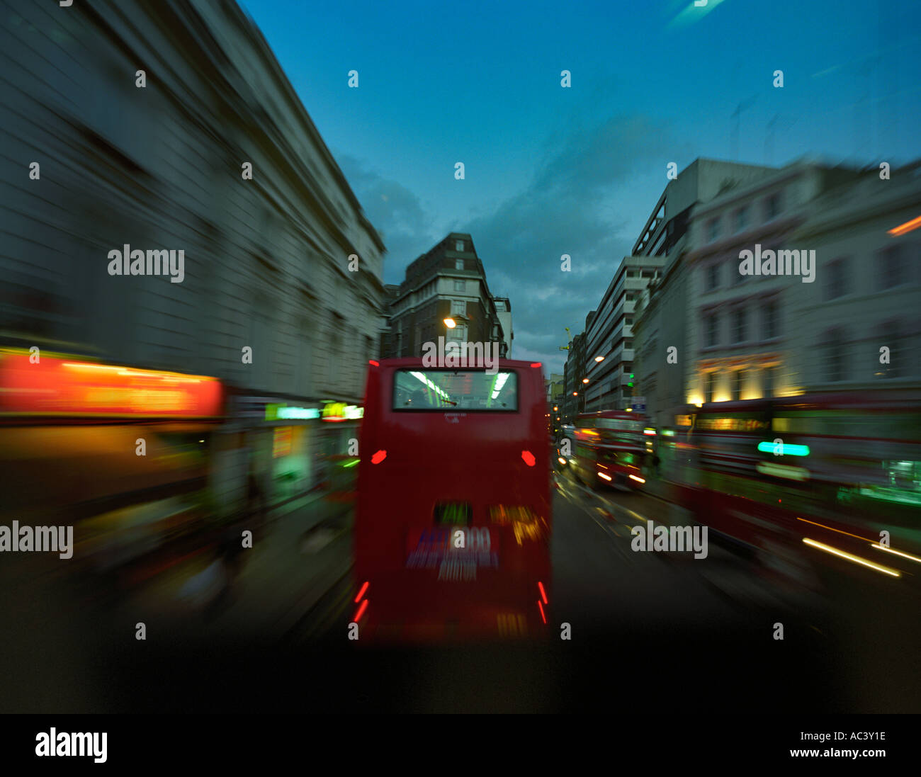 Blurred double deck red bus in ride in new oxford street central London ...
