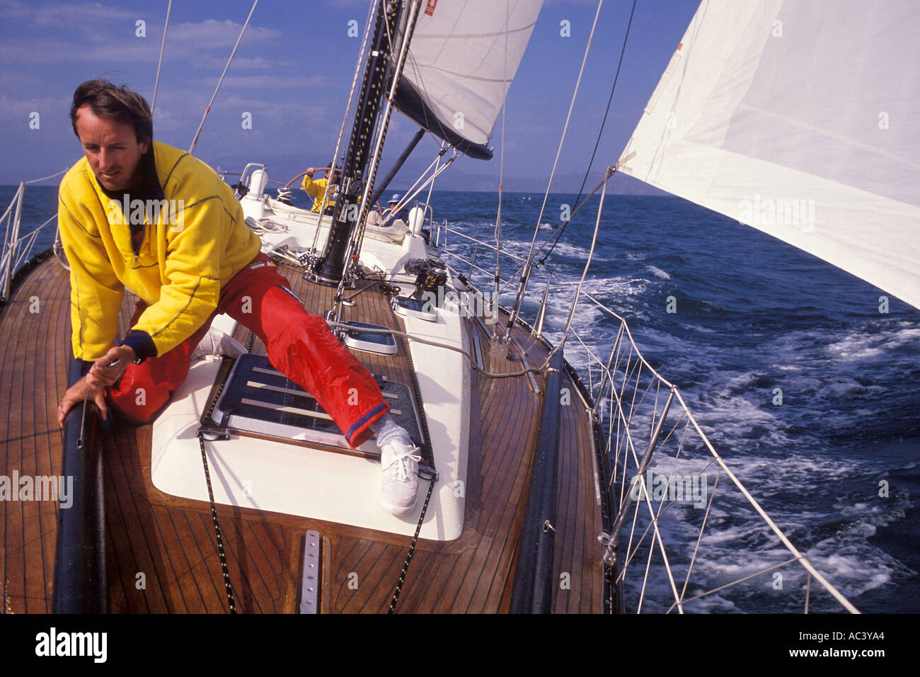 setting the spinnaker pole on sailboat off San Francisco, California ...