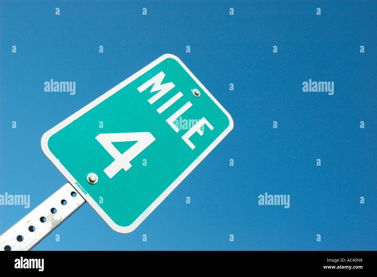 4 mile distance marker sign on freeway highway Stock Photo - Alamy