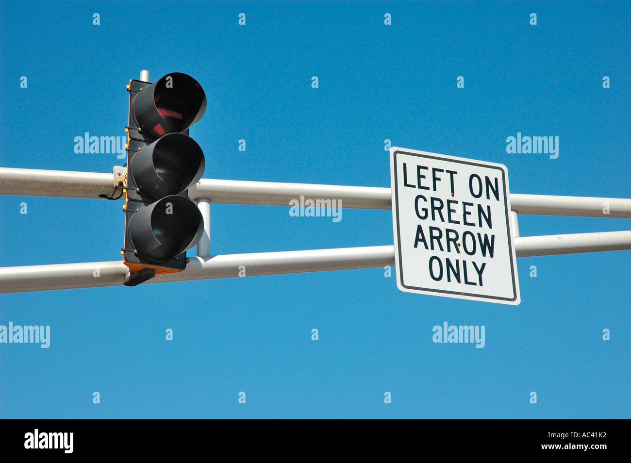 Left on green only sign on stop traffic light signal for cars in USA ...