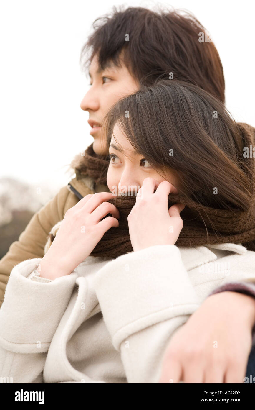 Young couple sharing scarf Stock Photo - Alamy