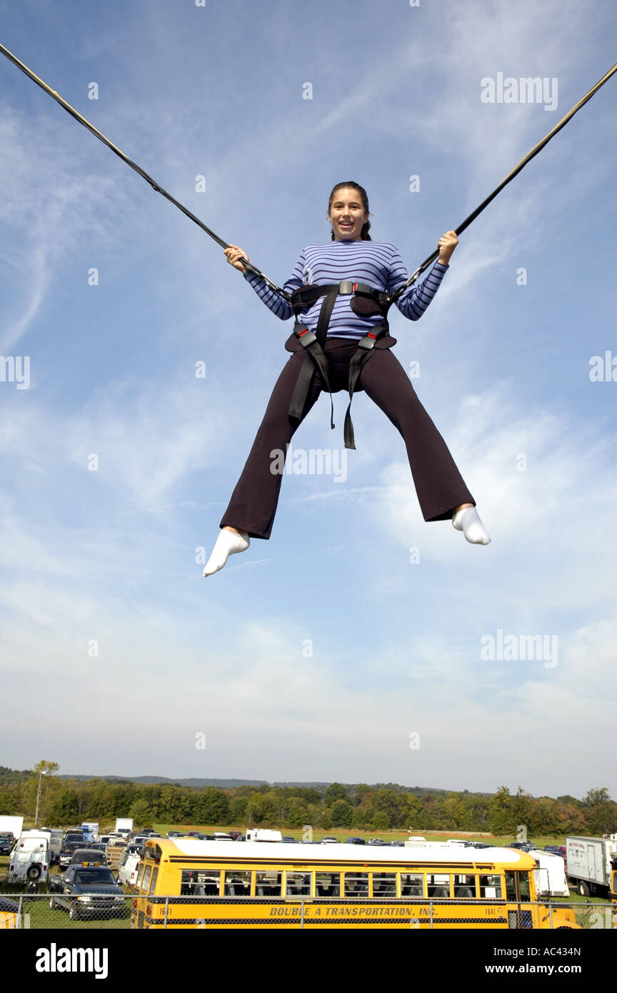 Durham, CT. Durham County Fair. Girl, age 12, on the Power Jump ride ...