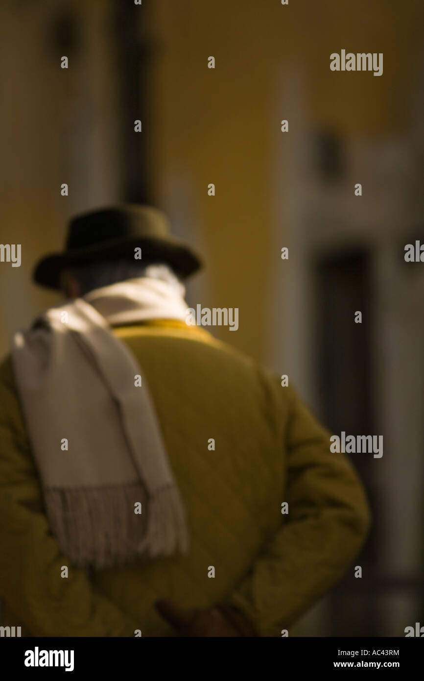 Hatted man walking in Florence winter light Stock Photo - Alamy