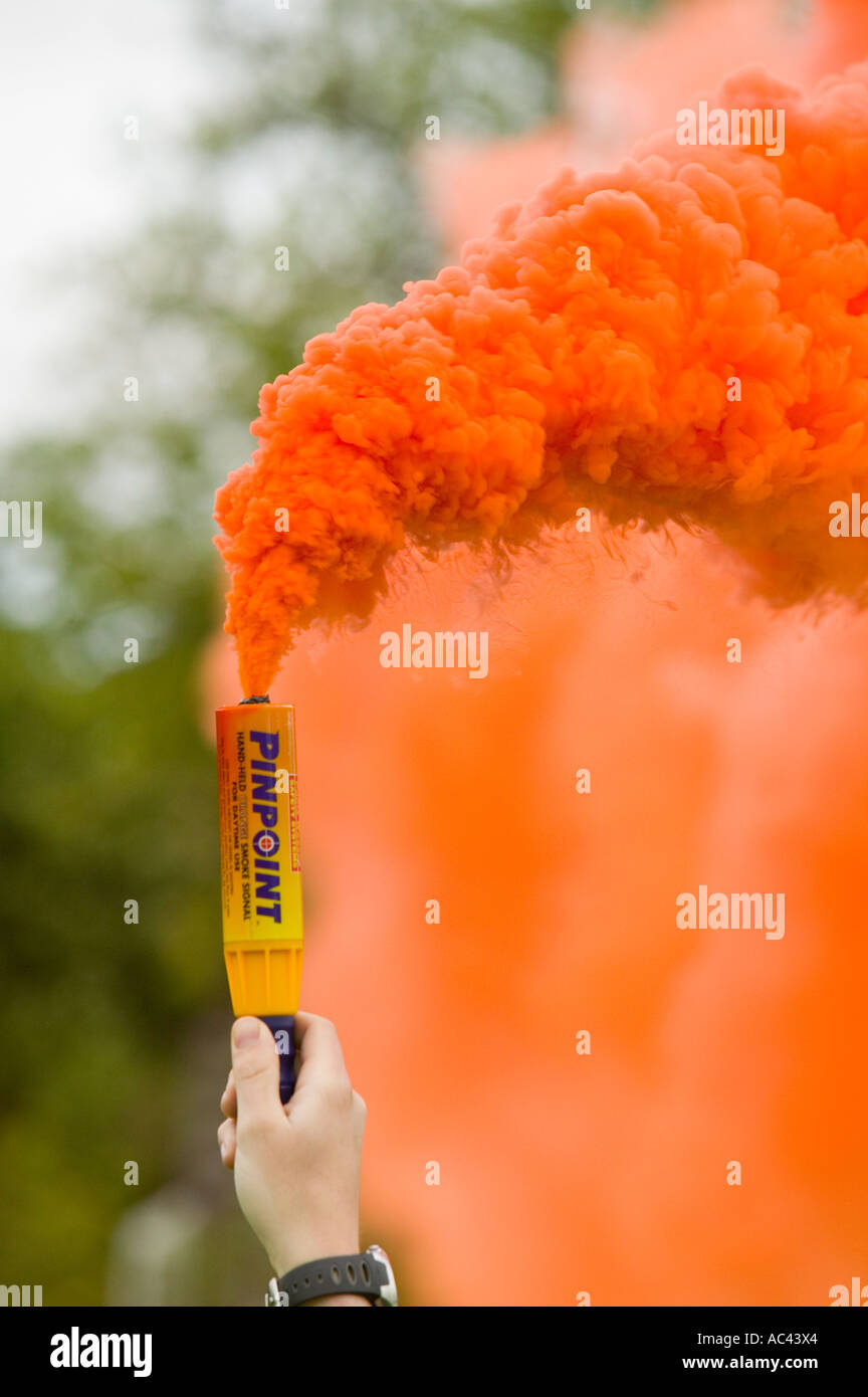 a mountain rescue team member uses a flare to attract and RAF sea King ...