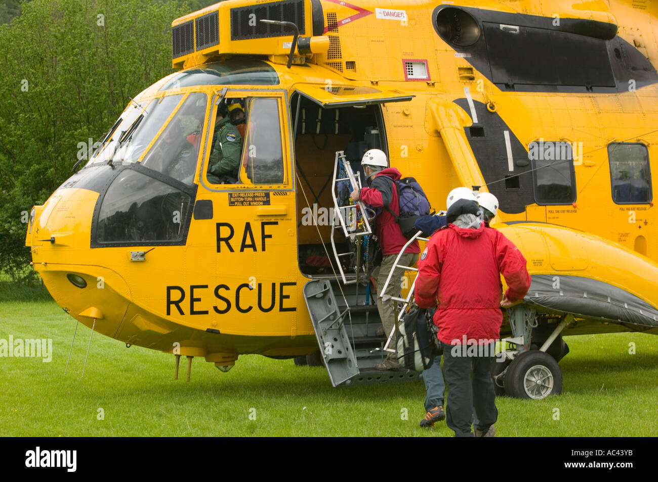 mountain rescue team members enter an RAF Sea King Helicopter on a ...