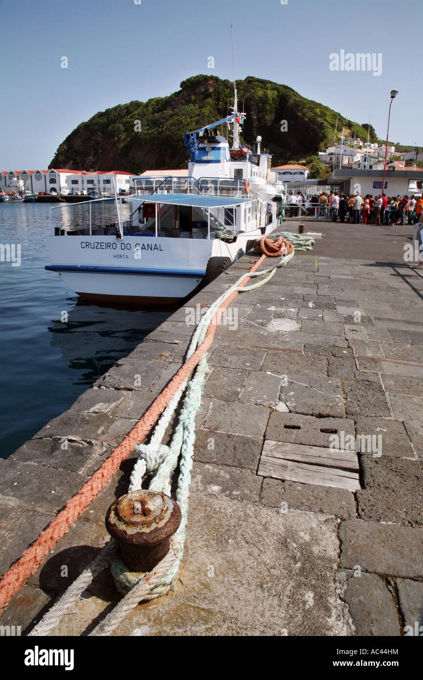 The island ferry loads its passengers, Horta harbour, Faial, The Azores ...