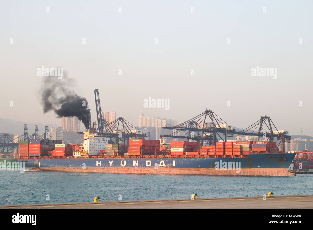 side profile of massive container ship in Kwai Chung Container Port ...