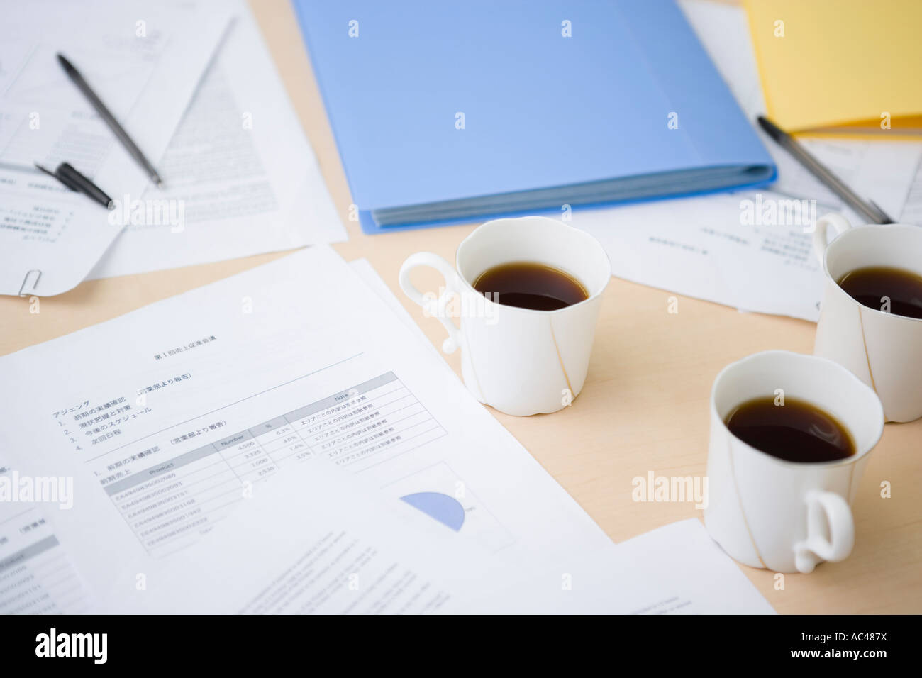 Messy meeting desk Stock Photo - Alamy