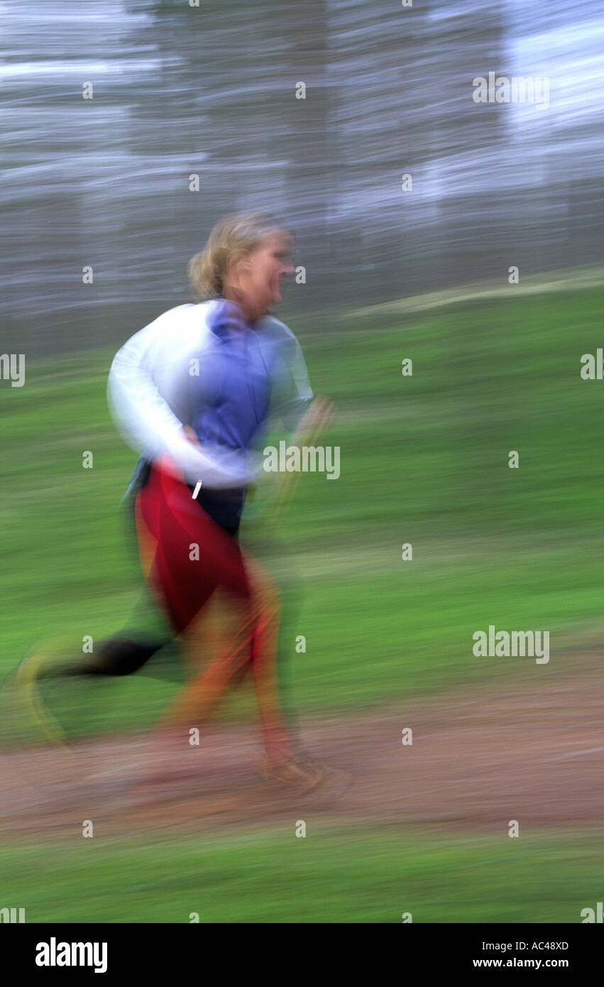 Female runner in the forest. Idre, Dalarna, Sweden Stock Photo - Alamy