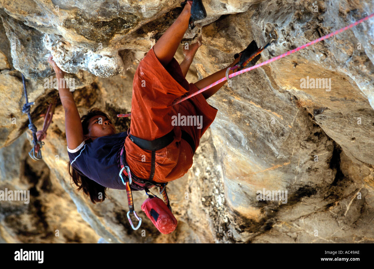 young man rock climbing on a beach in South Thailand Stock Photo - Alamy