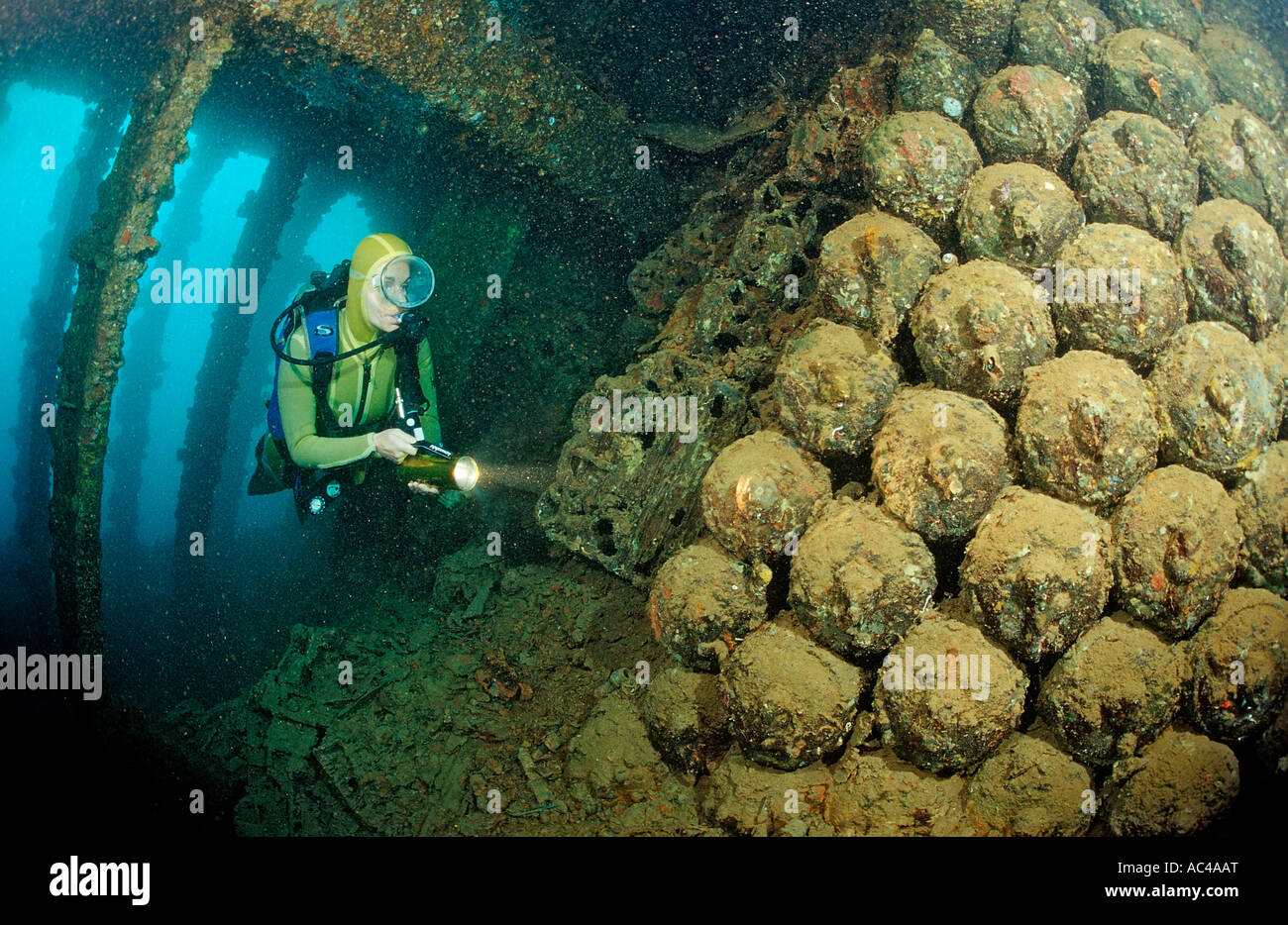 Scuba diver diving in the Umbria shipwreck Bombs Sudan Africa Red Sea ...