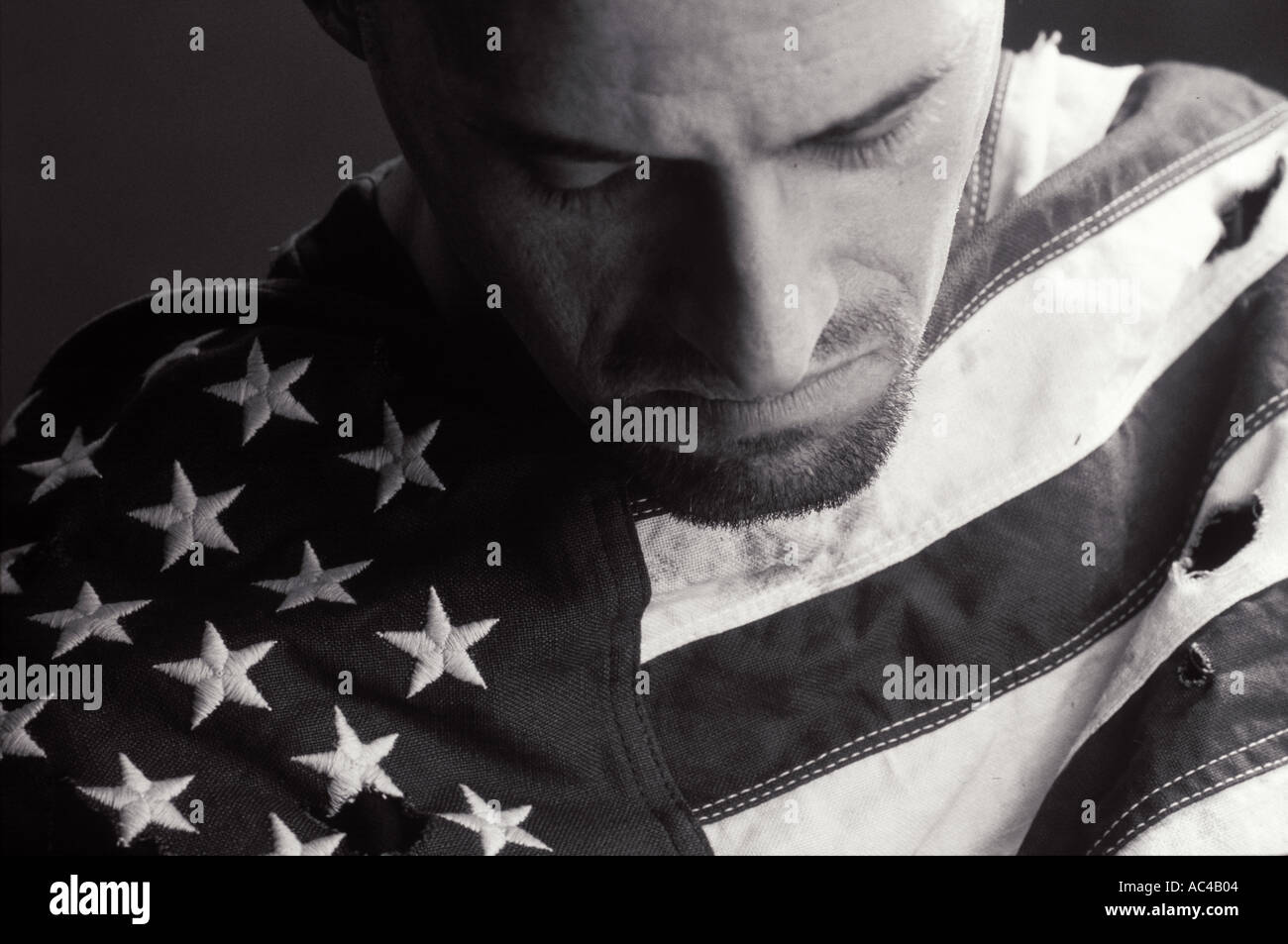 Portrait of angry patriot wrapped in American flag Stock Photo - Alamy