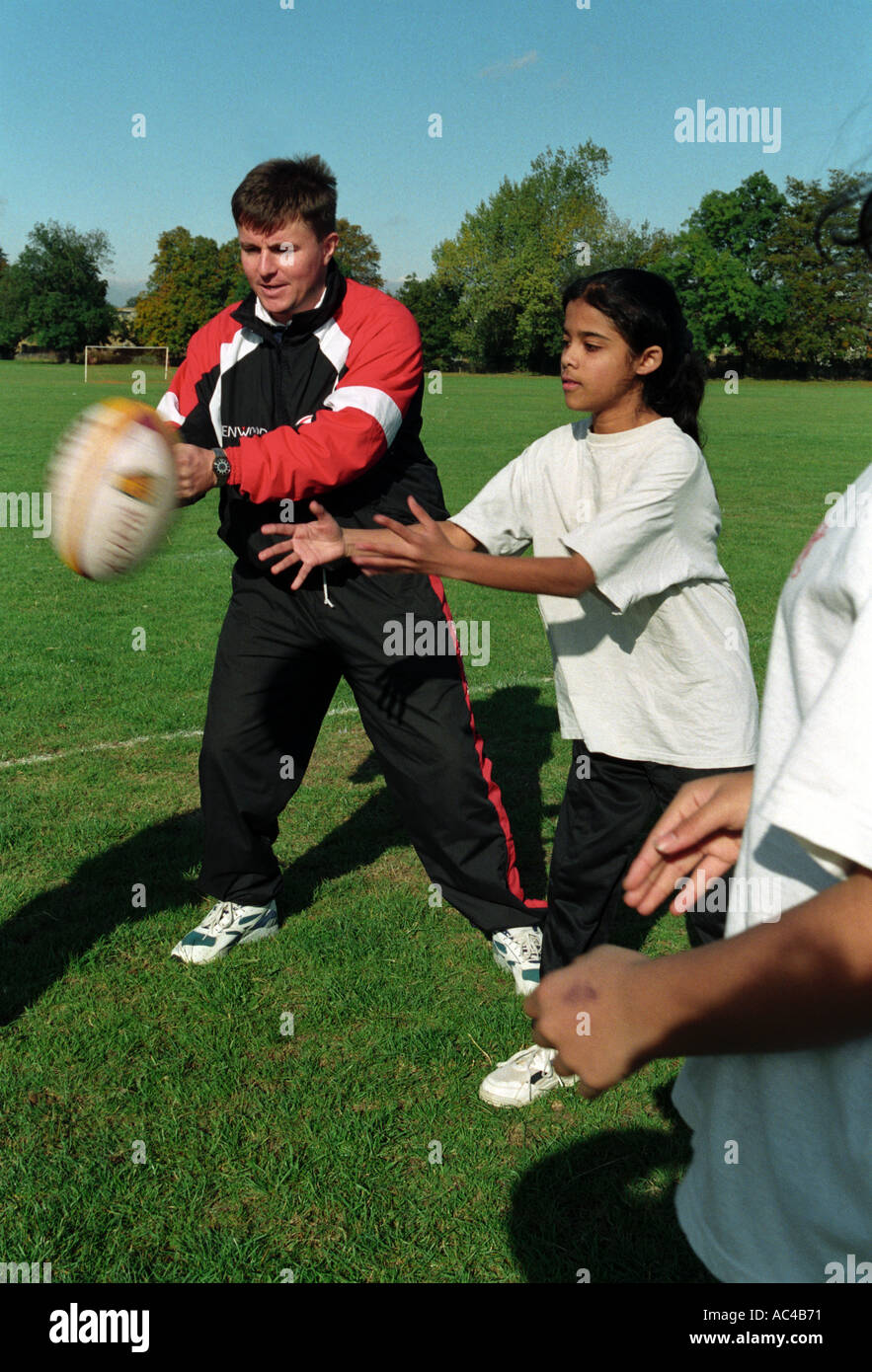 Girls playing with rugby ball hi-res stock photography and images - Alamy