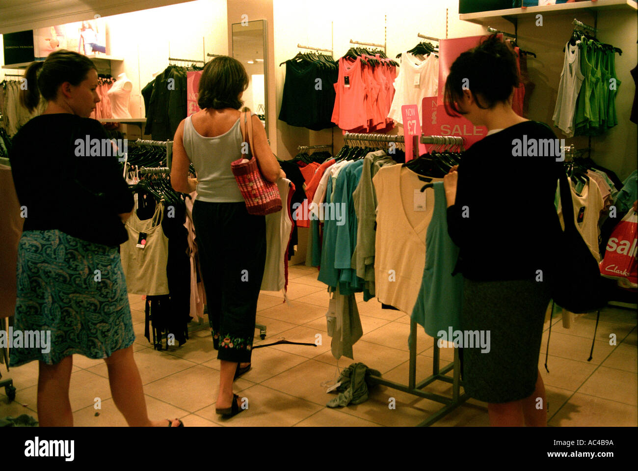 Women shopping in a clothes shop Stock Photo - Alamy