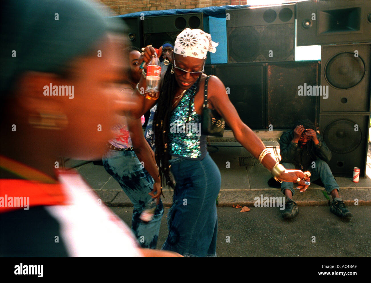 Black woman dancing in the streets near Notting Hill at carnival time ...