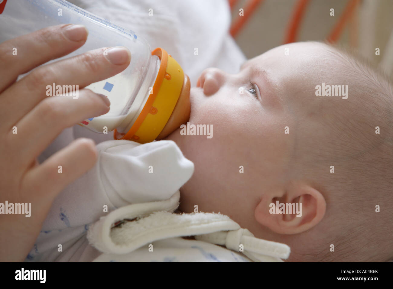 Baby being fed by bottle Stock Photo - Alamy