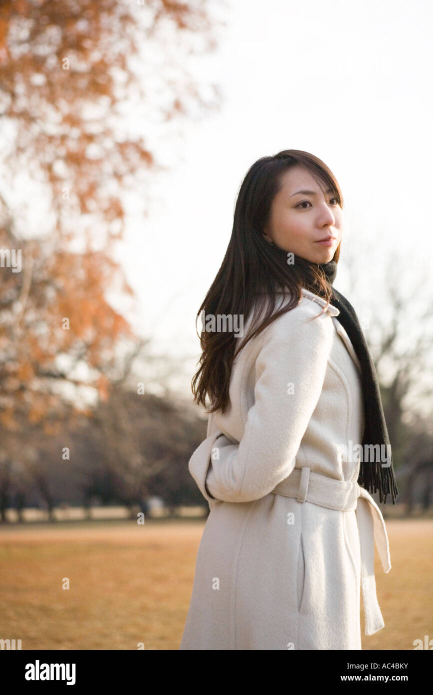 Young woman standing Stock Photo - Alamy