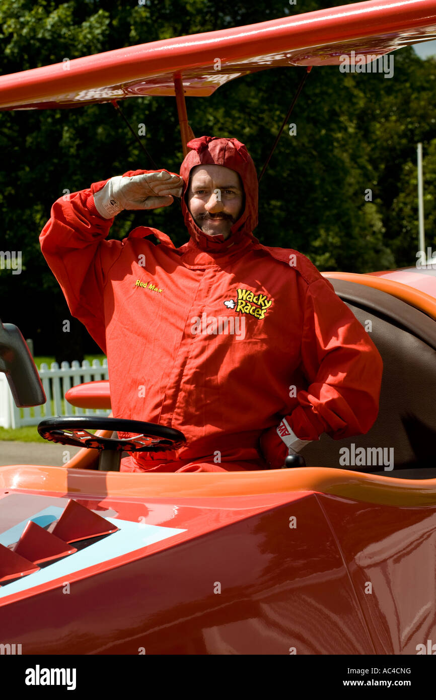 The Red Max salutes from the Crimson Haybailer at Goodwood Festival of ...