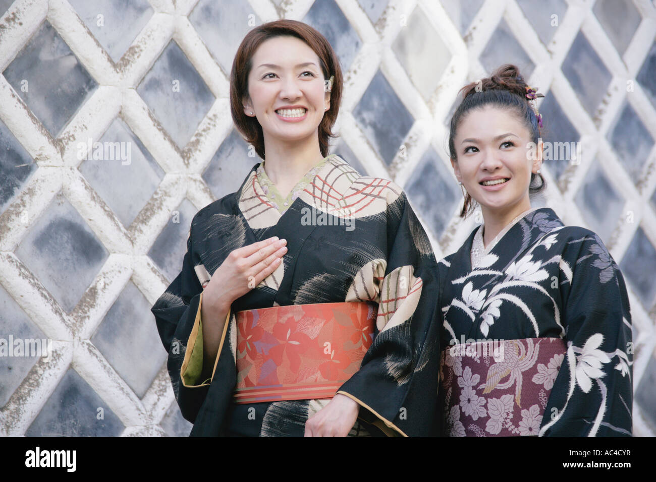 Two young women wearing kimono Stock Photo - Alamy