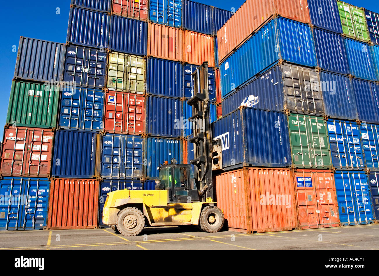 Shipping Industry / A Heavy Forklift at work in a Container Depot. The ...