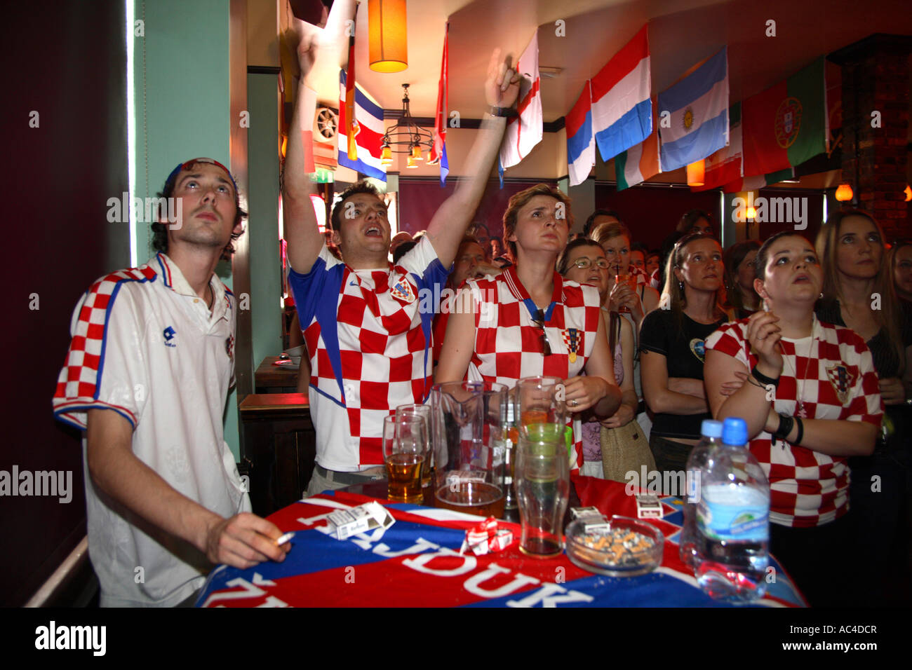 Croatian fans watching World Cup game vs Japan in London pub Stock ...