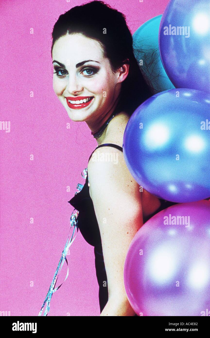 W 18743 37 MODEL RELEASED Female with balloons and streamers Richard ...