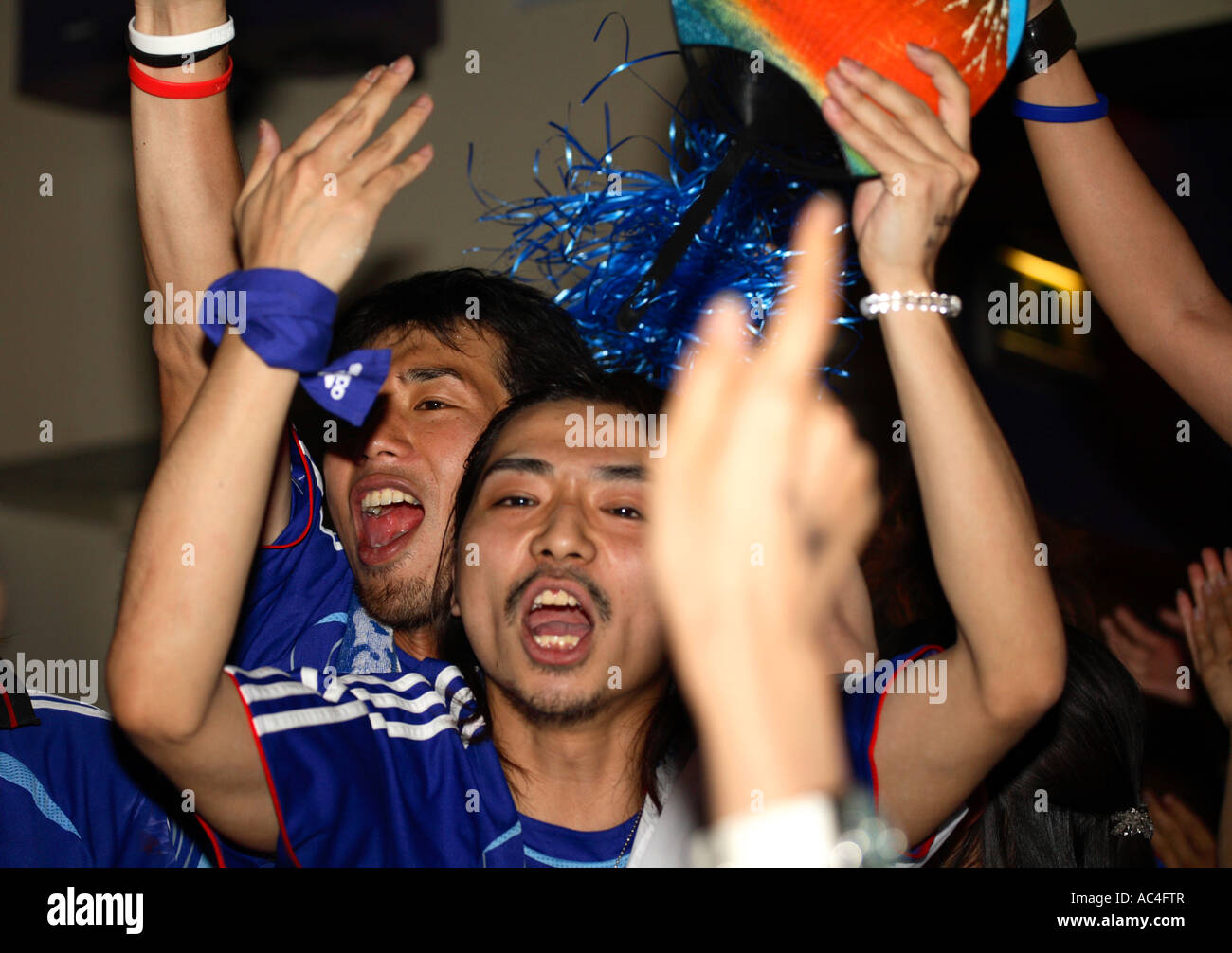 Japanese fans cheering their sides 1-4 defeat vs Brazil, 2006 World Cup ...