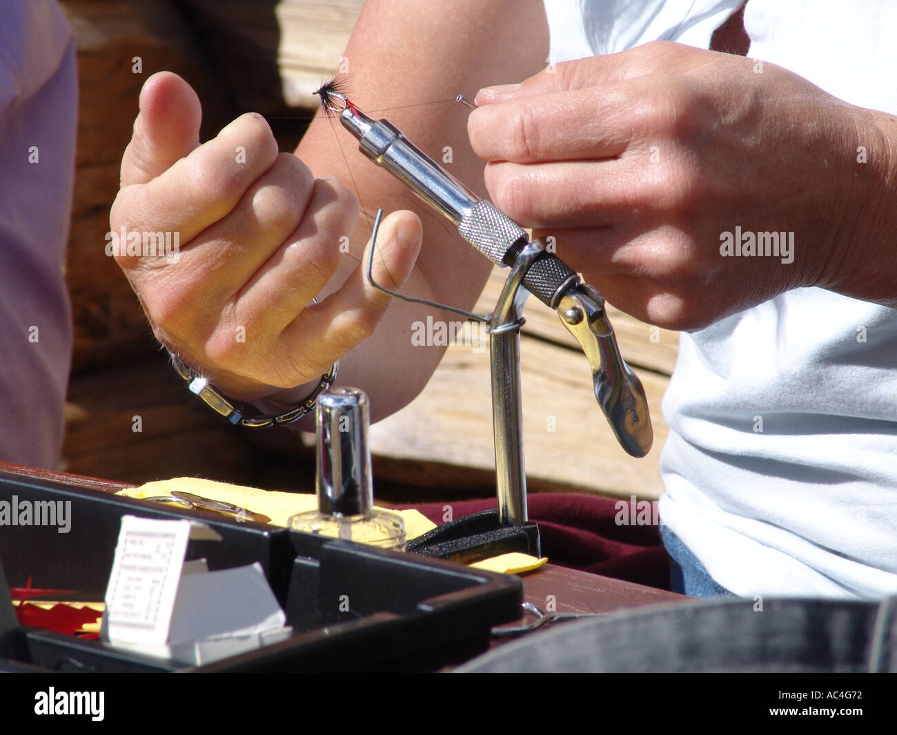 Making a fishing fly Stock Photo - Alamy
