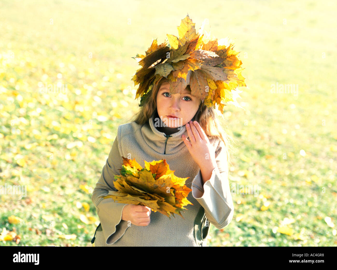 Girl with leaves on head Stock Photo - Alamy