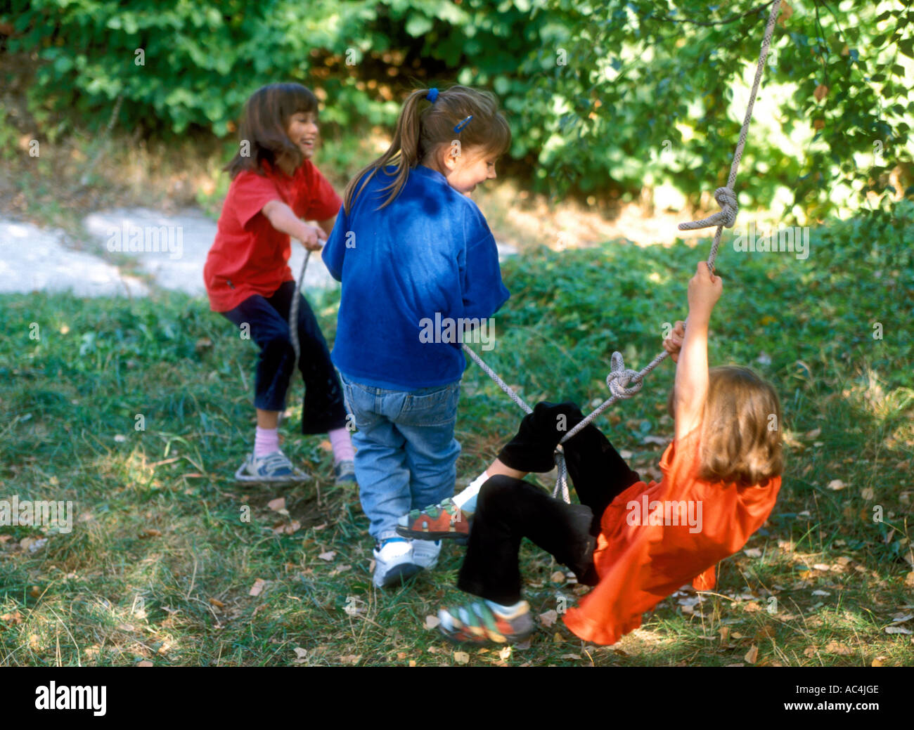 Children playing with rope Stock Photo - Alamy