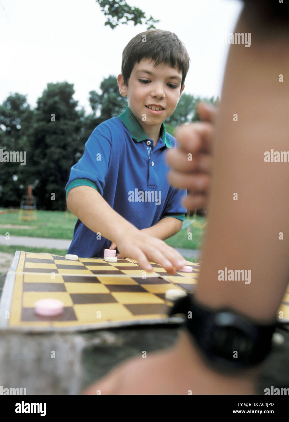 Boys playing checkers hi-res stock photography and images - Alamy