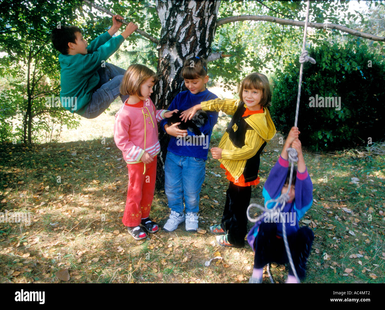 Kids with rabbit Stock Photo - Alamy