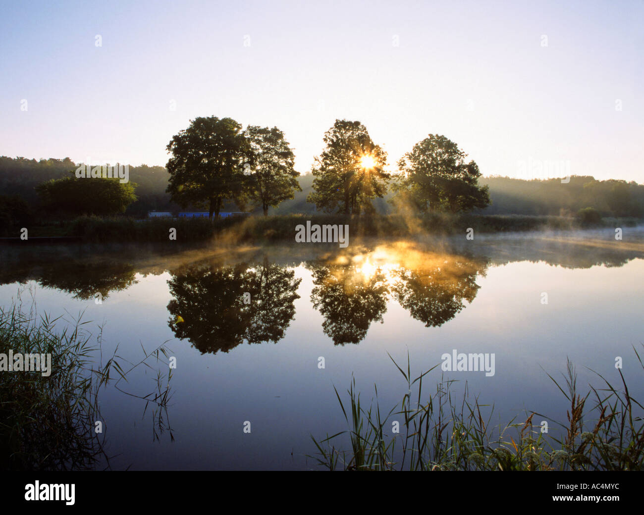 Sunrise over lake Stock Photo - Alamy
